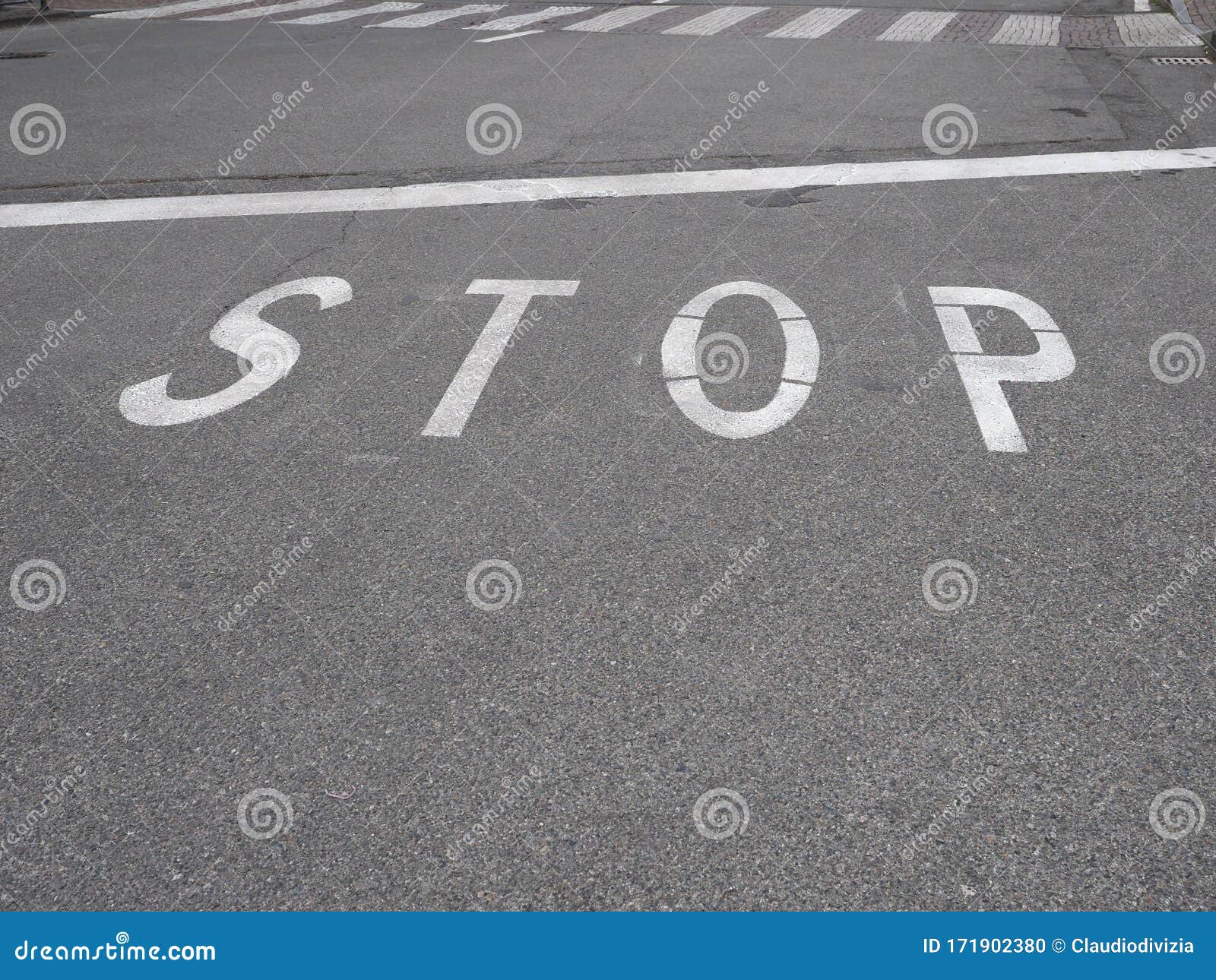 Stop sign on tarmac stock photo. Image of symbol, traffic - 171902380