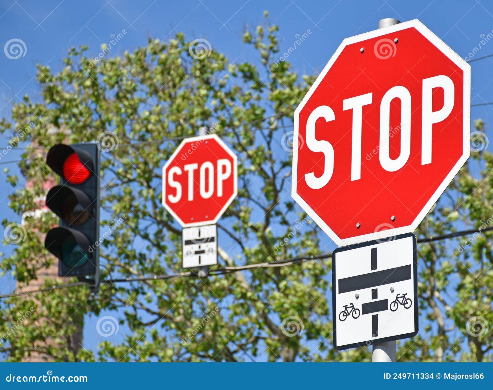 Stop Signs at the Road Crossing Stock Photo - Image of angle, hanging ...