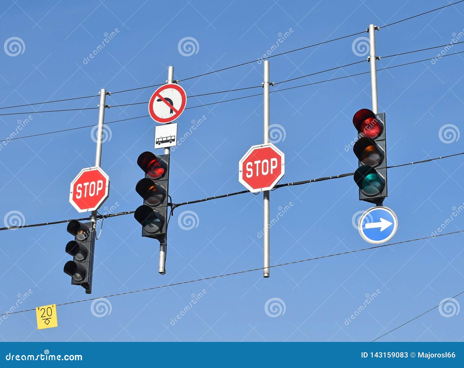 Stop Signs and Traffic Lights at the Road Crossing Stock Image - Image ...