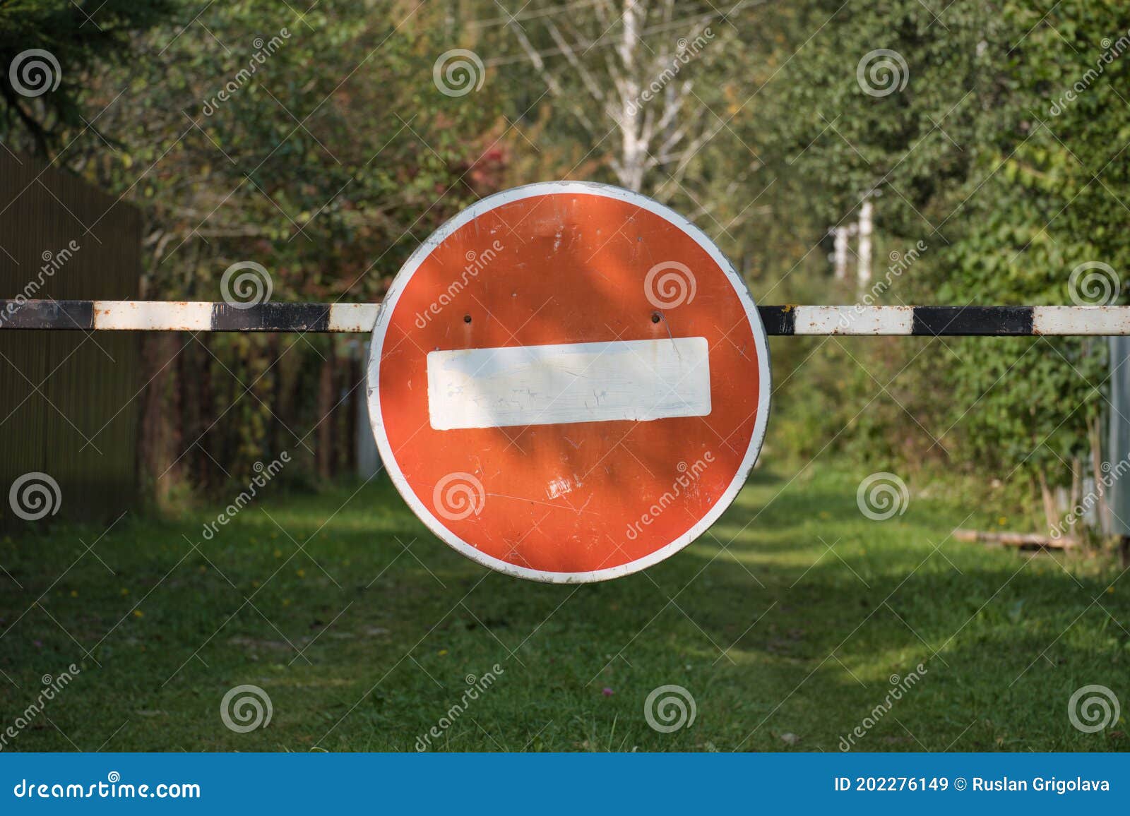 Stop Traffic Sign on the Barrier Stock Image - Image of sign, trees ...