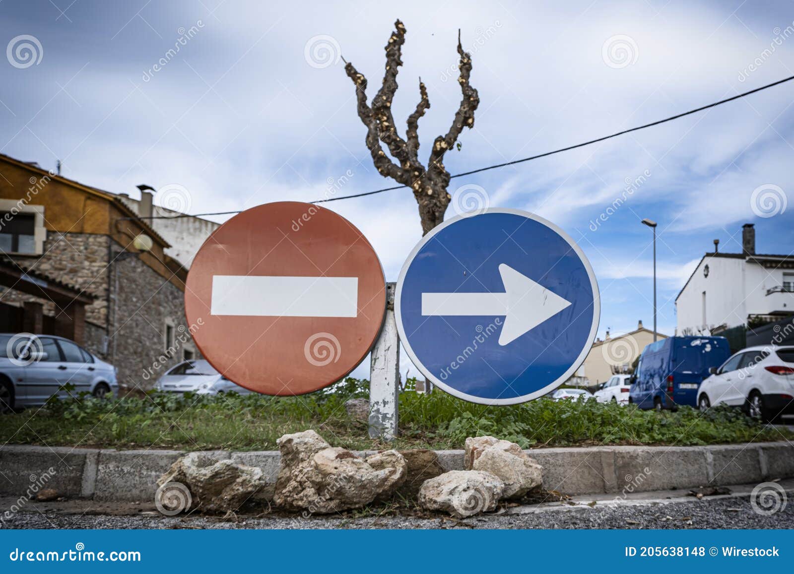 Stop and a Turning Sign on the Road Under a Cloudy Sky Stock Photo ...