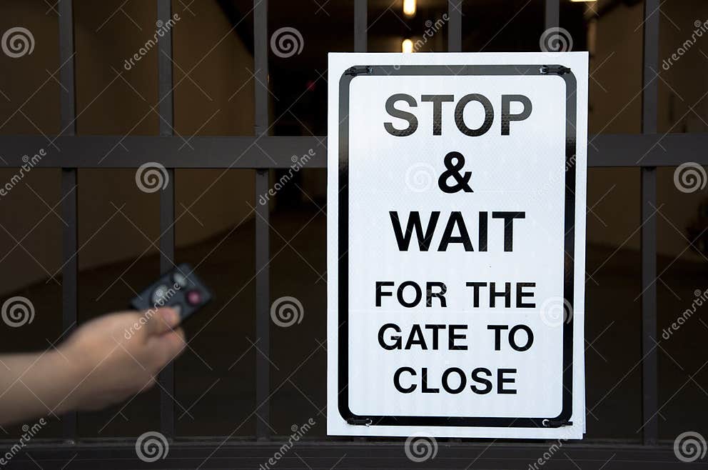 Stop and Wait Sign before Gate Stock Image - Image of wait, garage ...
