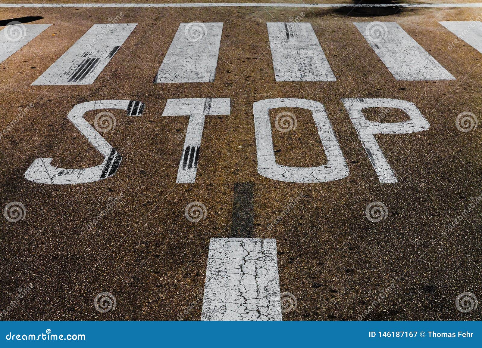 Stop written on the street stock image. Image of path - 146187167