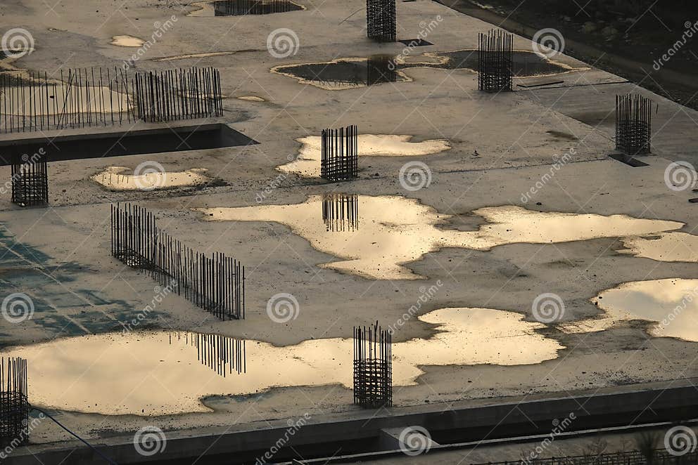 Stopped Construction and Rusty Bars and Puddles Stock Photo - Image of ...