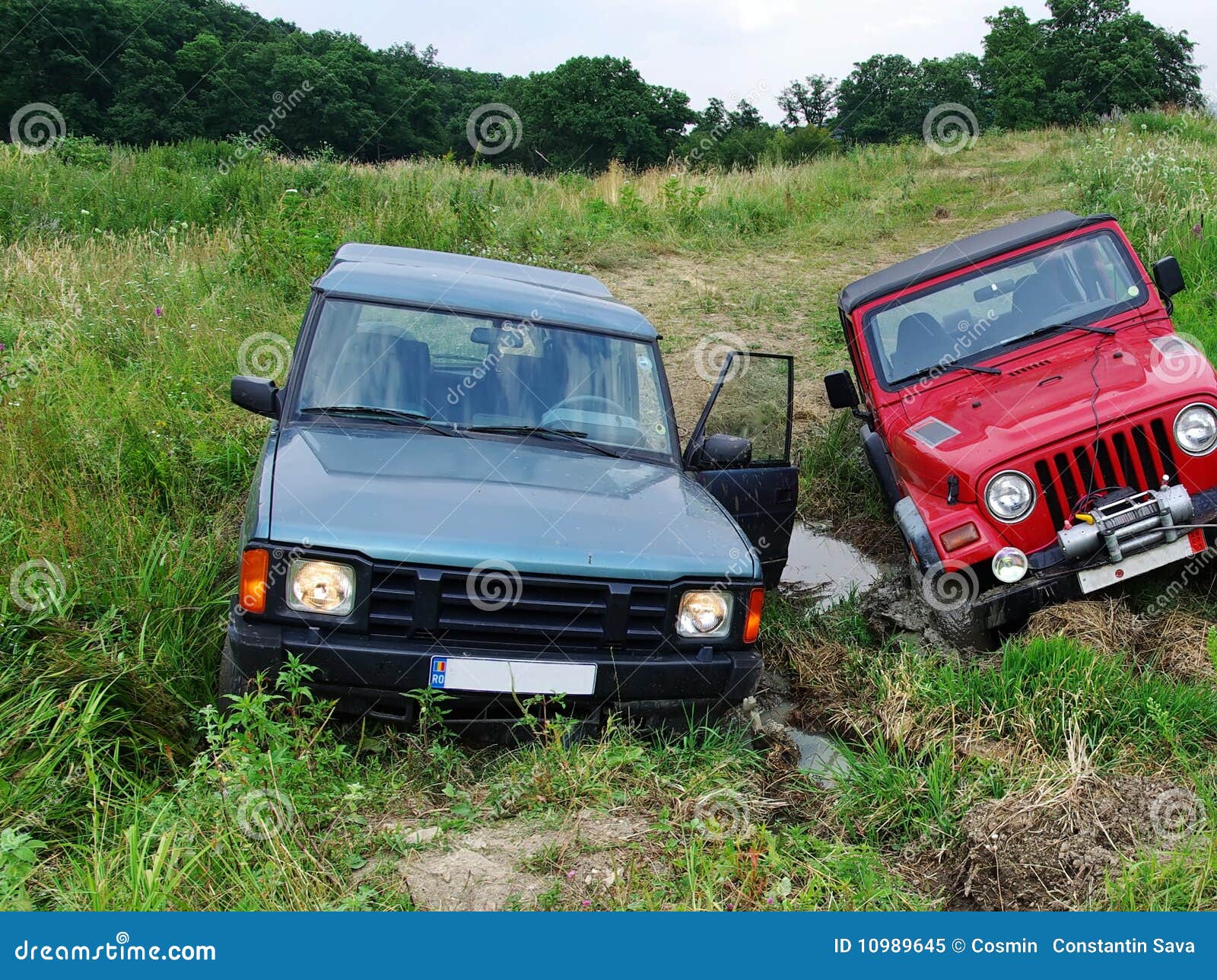 Two Off Road Vehicles Coming Out Of A Mud Hole Hazard In Off-road ...