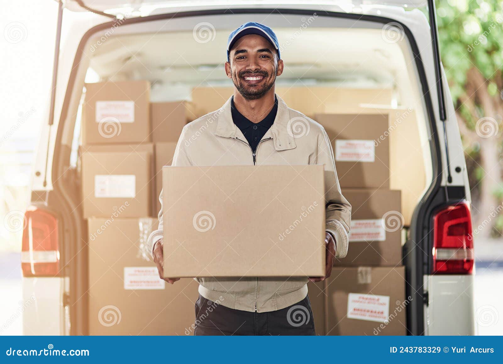 Stopping Off for Another Delivery. Portrait of a Delivery Man Unloading ...