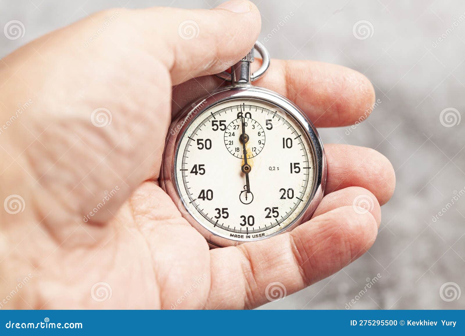 Stopwatch in Hand on a Gray Background Stock Photo - Image of meter ...