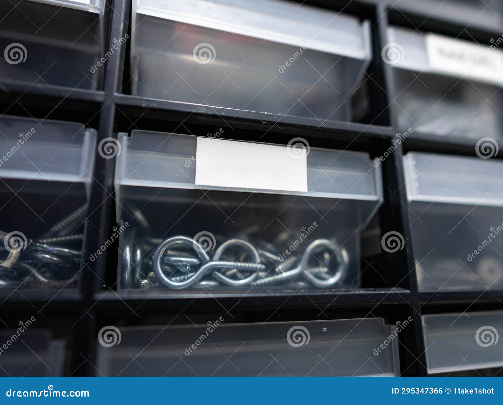 Storage Box in a Workshop with an Empty White Label Stock Photo - Image ...