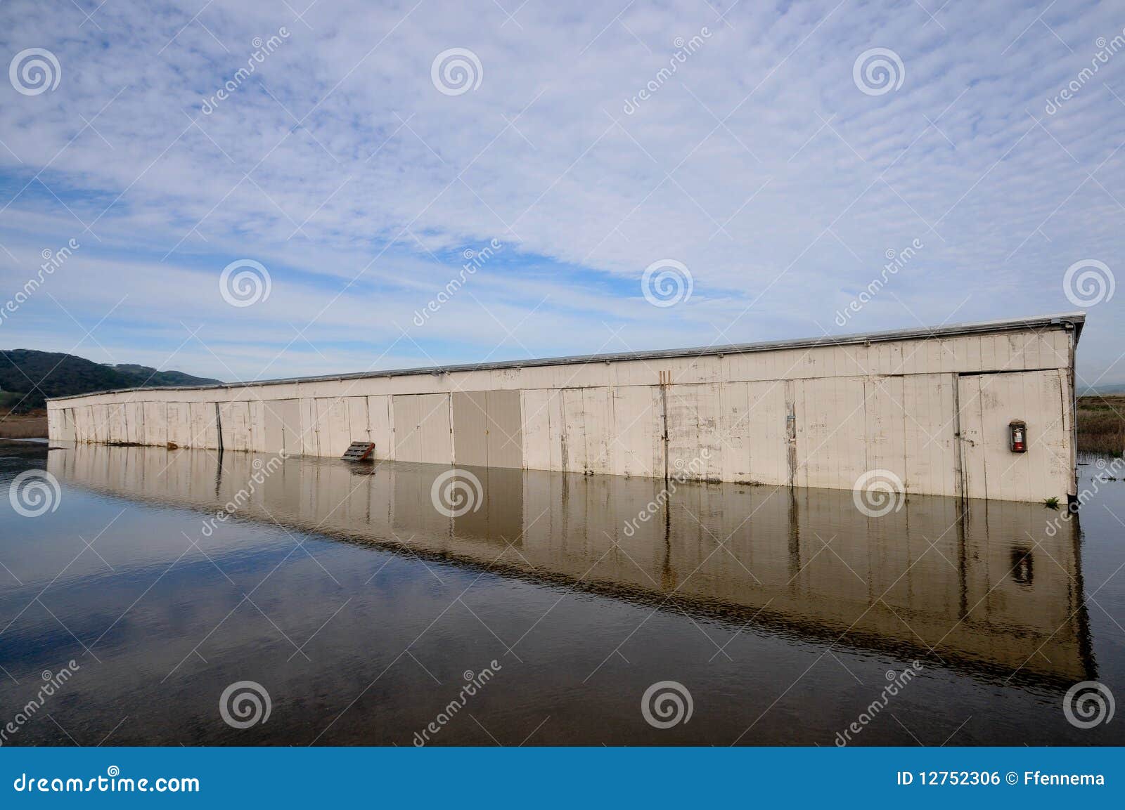 Storage Building is Partly Underwater Stock Photo - Image of building ...