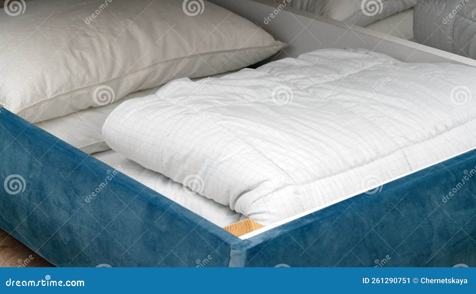 Storage Drawer Under Bed with White Blanket and Pillows Indoors ...
