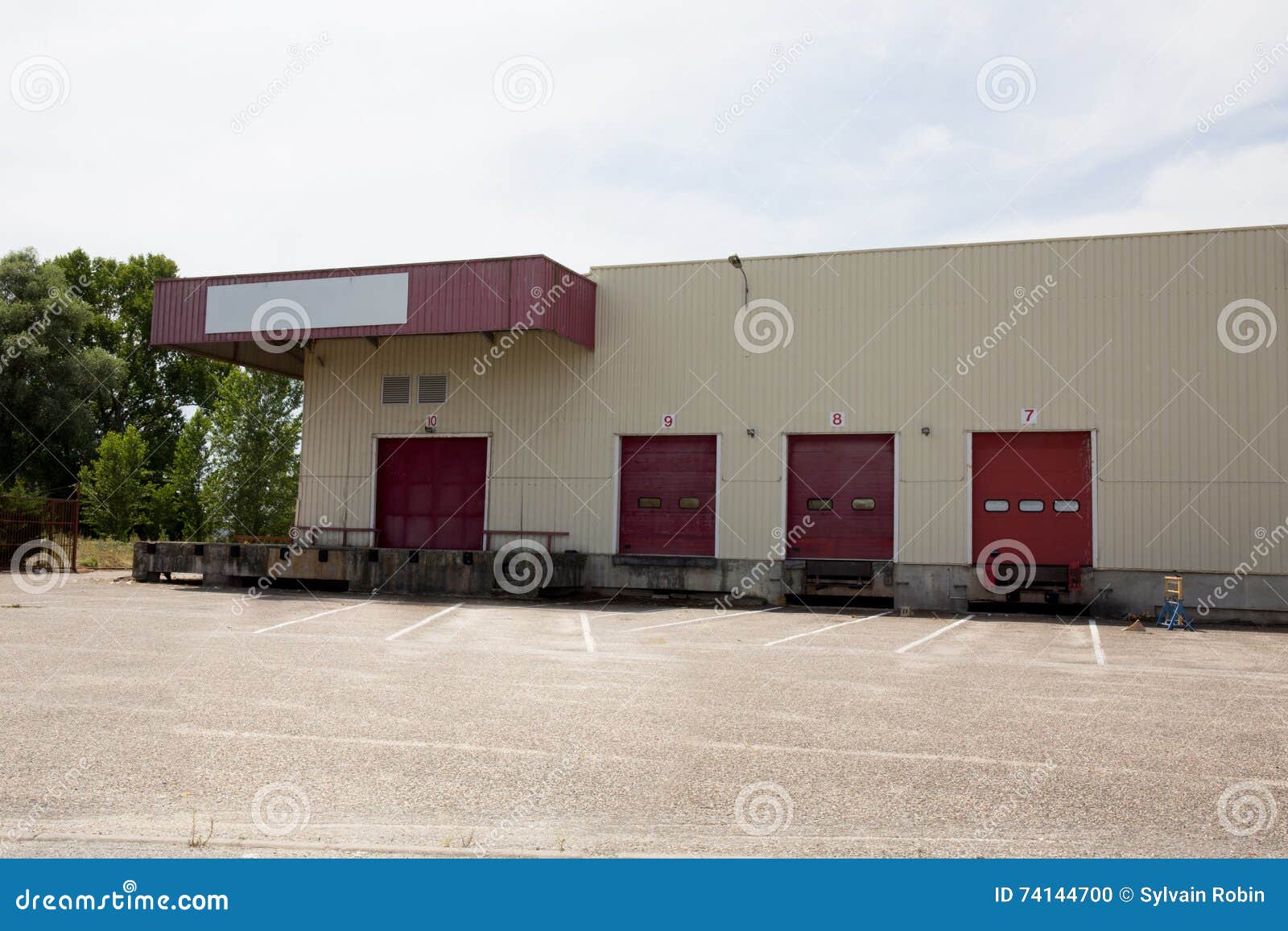 Storage Gate, Red and White Industrial Building Under Blue Sky Stock ...