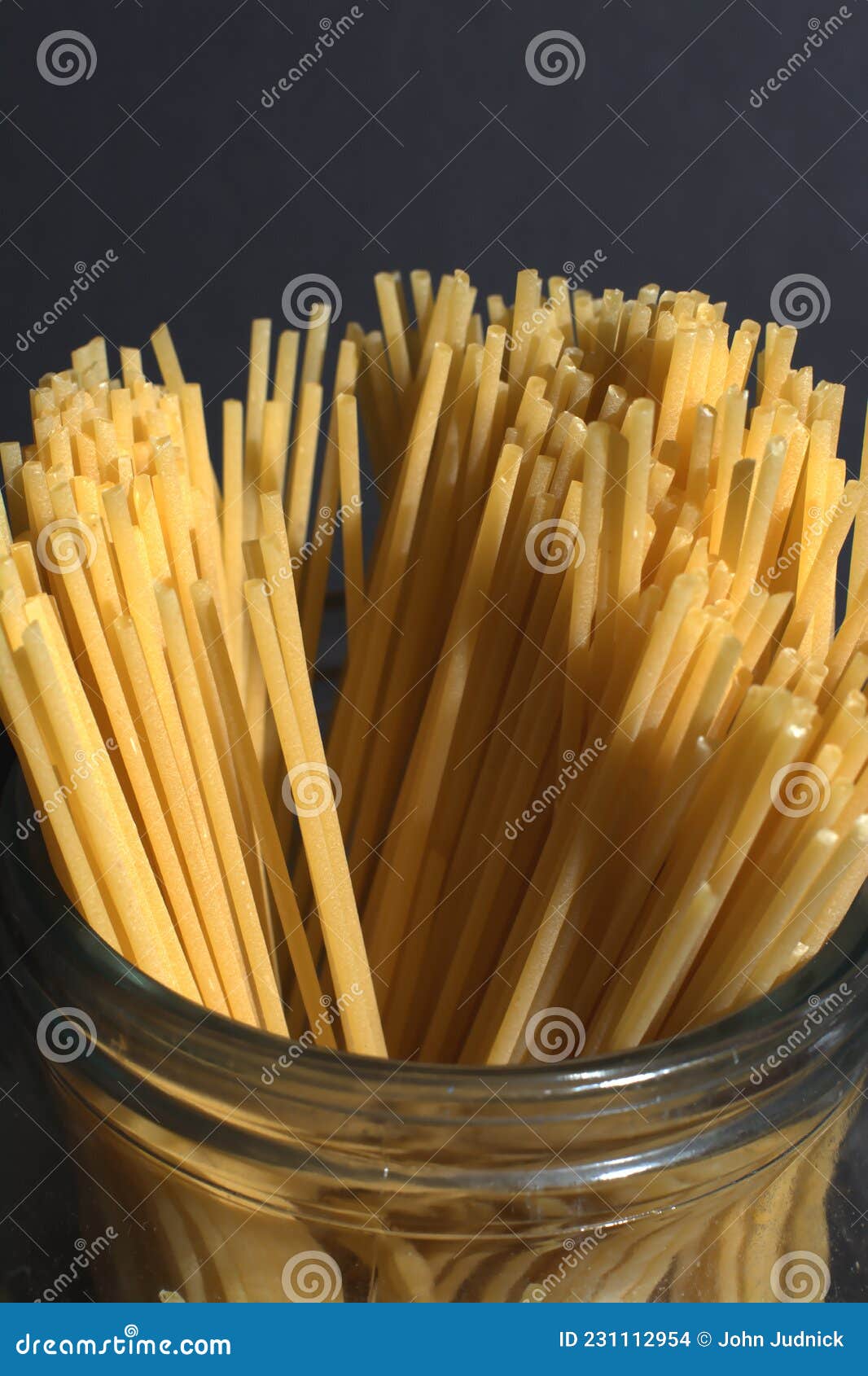 Spaghetti in my kitchen. stock photo. Image of container - 231112954