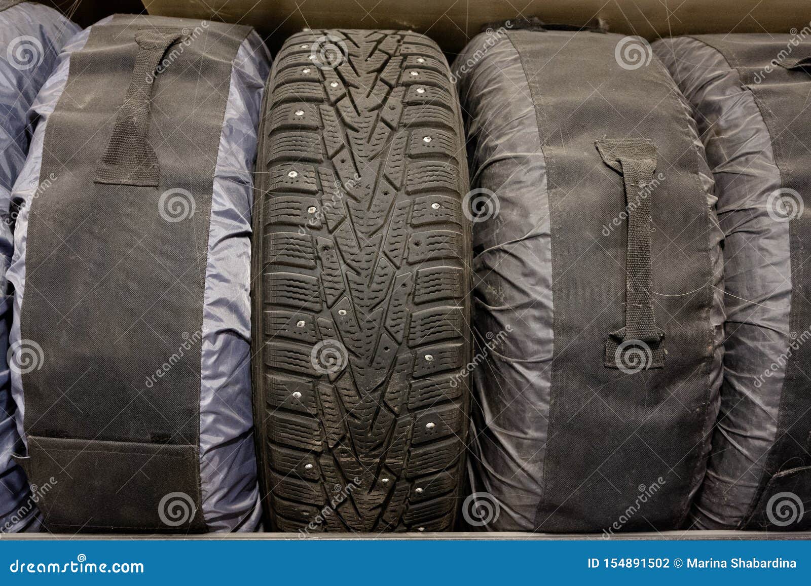 Storage of Old Winter Tires in Specialized Covers Stock Photo - Image ...