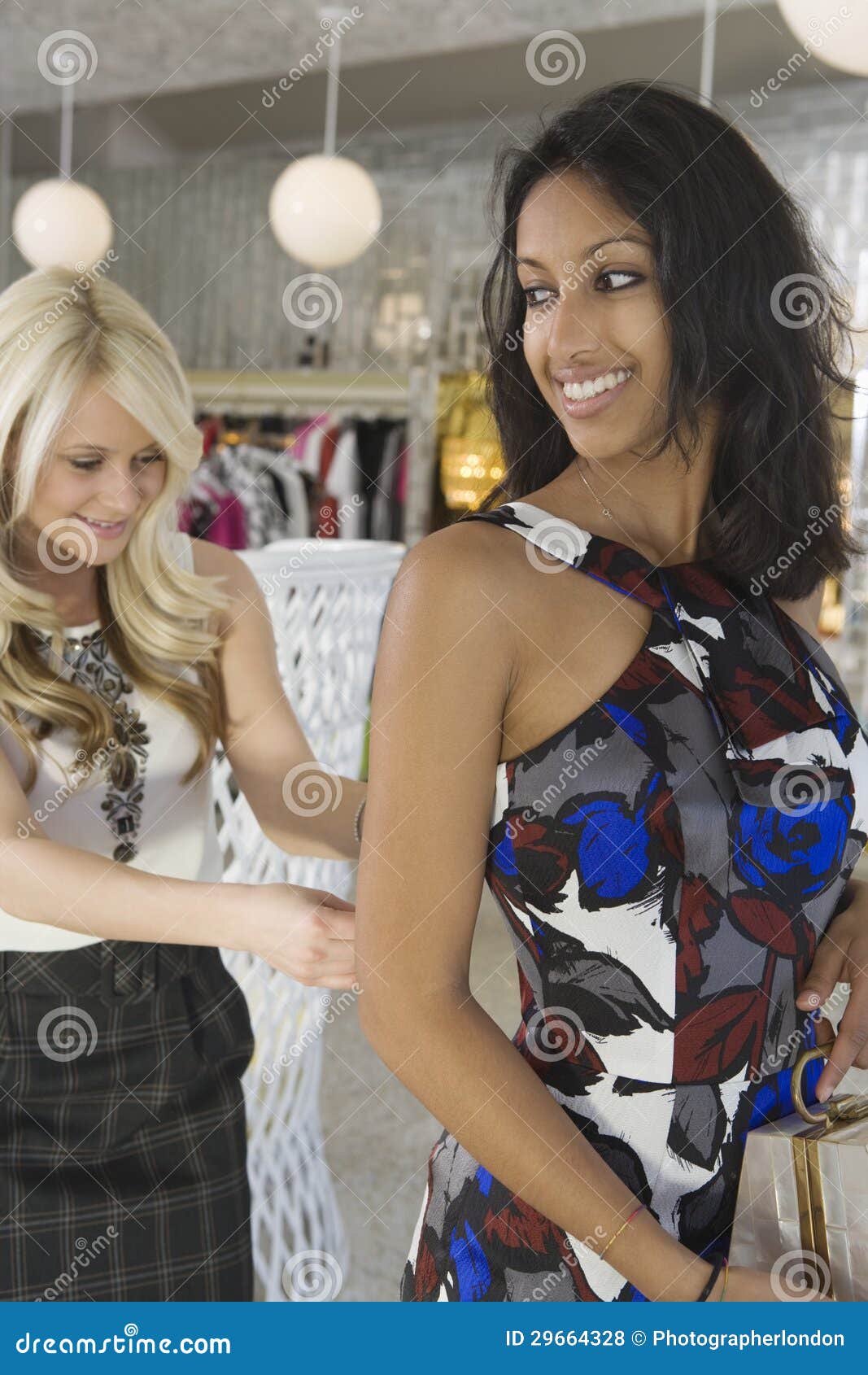 Store Assistant Helps Woman with Dress Stock Photo - Image of beauty ...