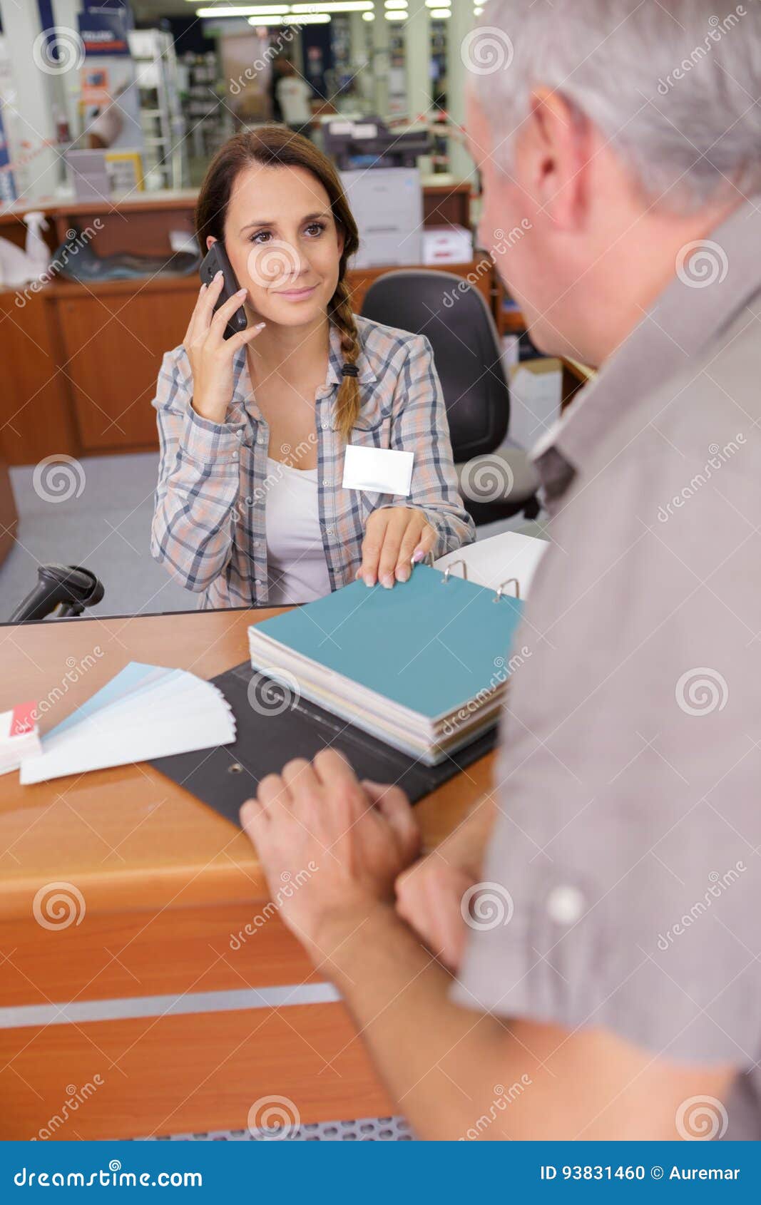 Store Clerk Giving Assistance To Customer at Store Stock Photo - Image ...