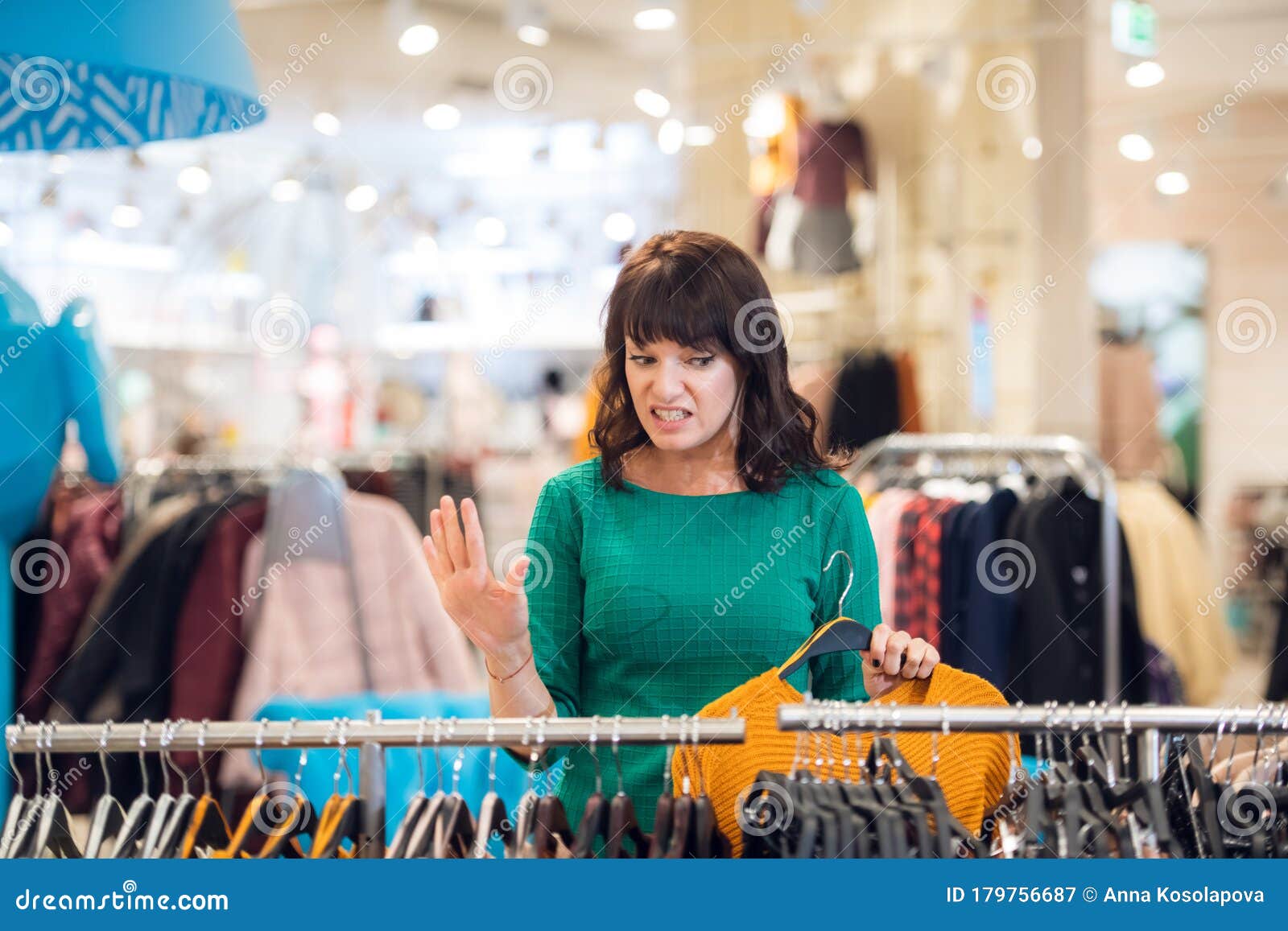 A Store Manager is Unhappy with the Way the Clothes are Organised on a ...