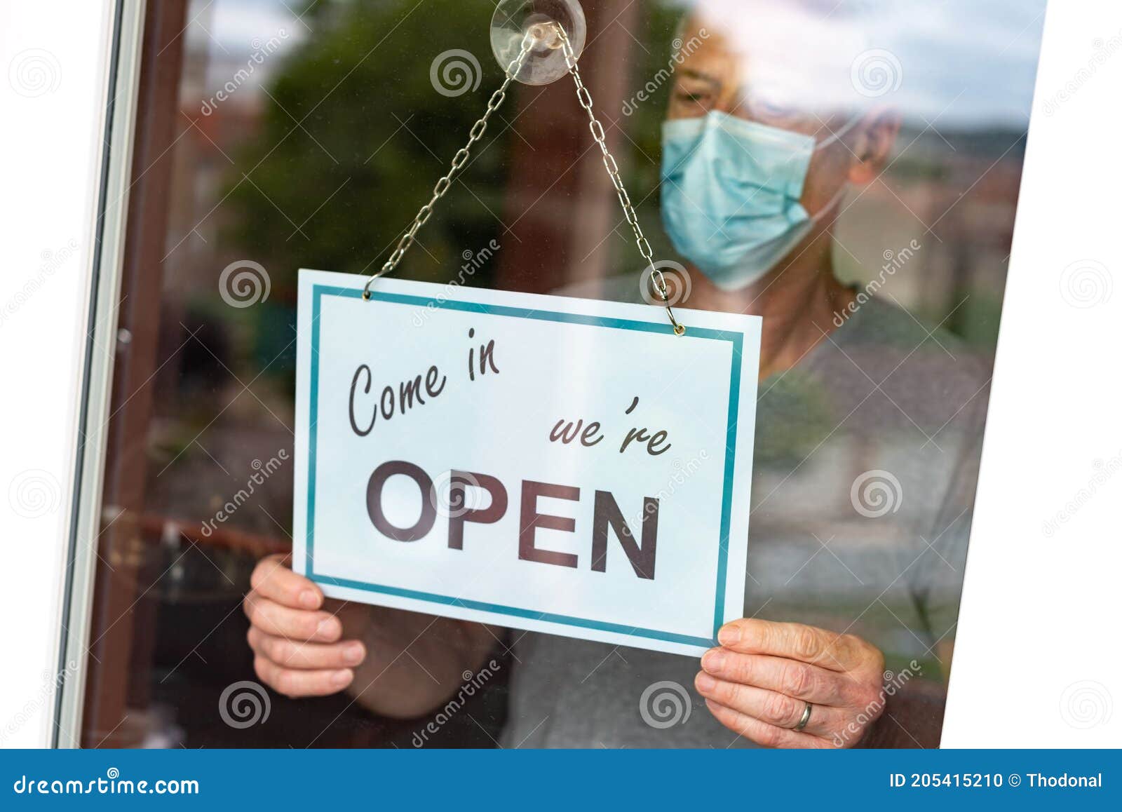 Store Owner Hanging Open Sign on Window Stock Photo - Image of ...
