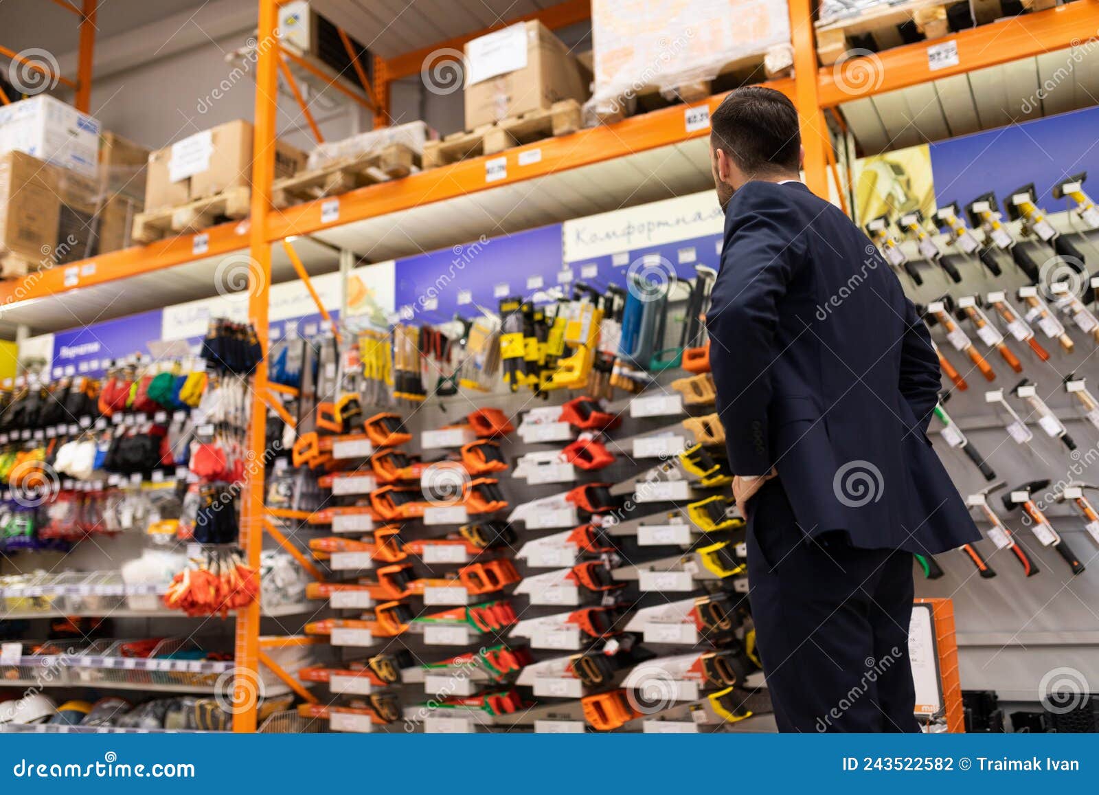 Store Owner Inspecting Shop Windows in a Construction Hypermarket Stock ...