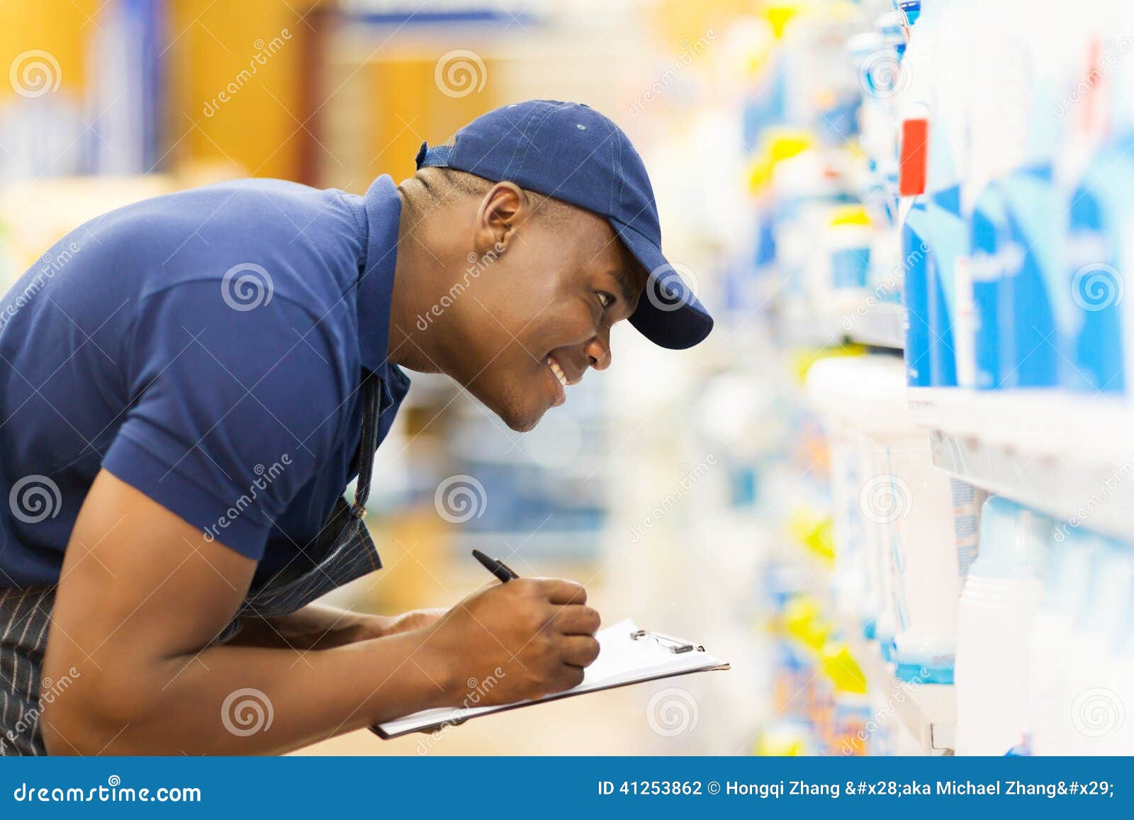 Store worker taking stock stock photo. Image of cheerful - 41253862