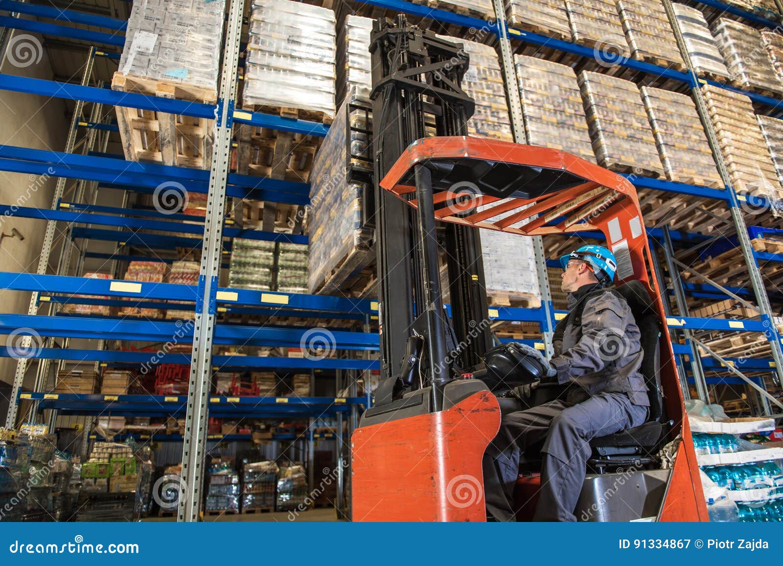 An Employee Of The Warehouse Of An Online Store Scans The Barcodes On ... An Employee Of The Warehouse Of An Online Store Scans The Barcodes On ...