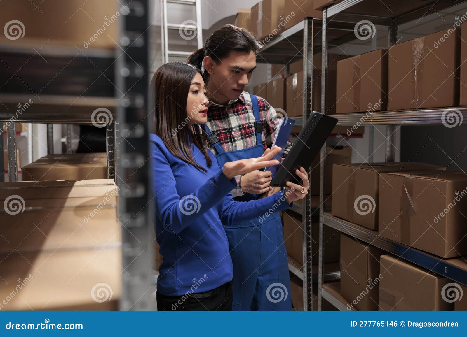 Storehouse Workers Managing Inventory Control, Standing in Storage ...