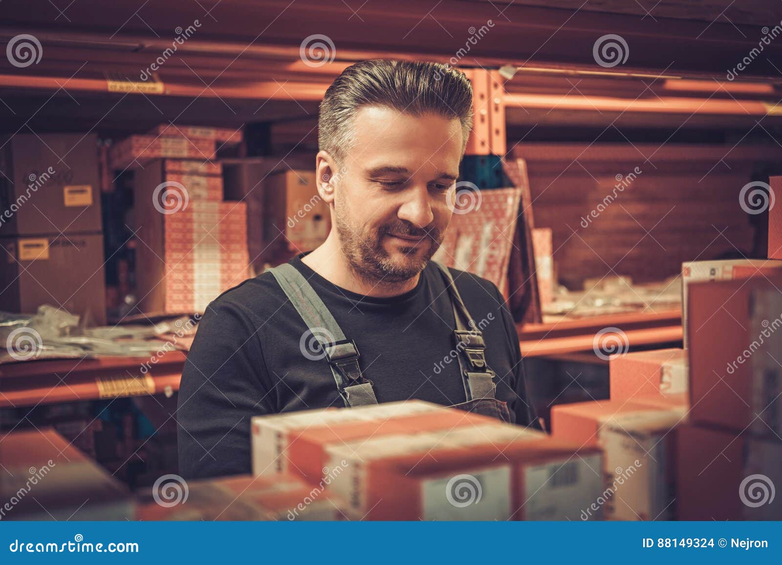Storekeeper Working in a Warehouse Stock Photo - Image of automobile ...