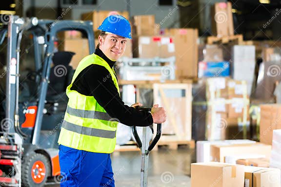 Storeman with Mover at Warehouse of Forwarding Stock Photo - Image of ...