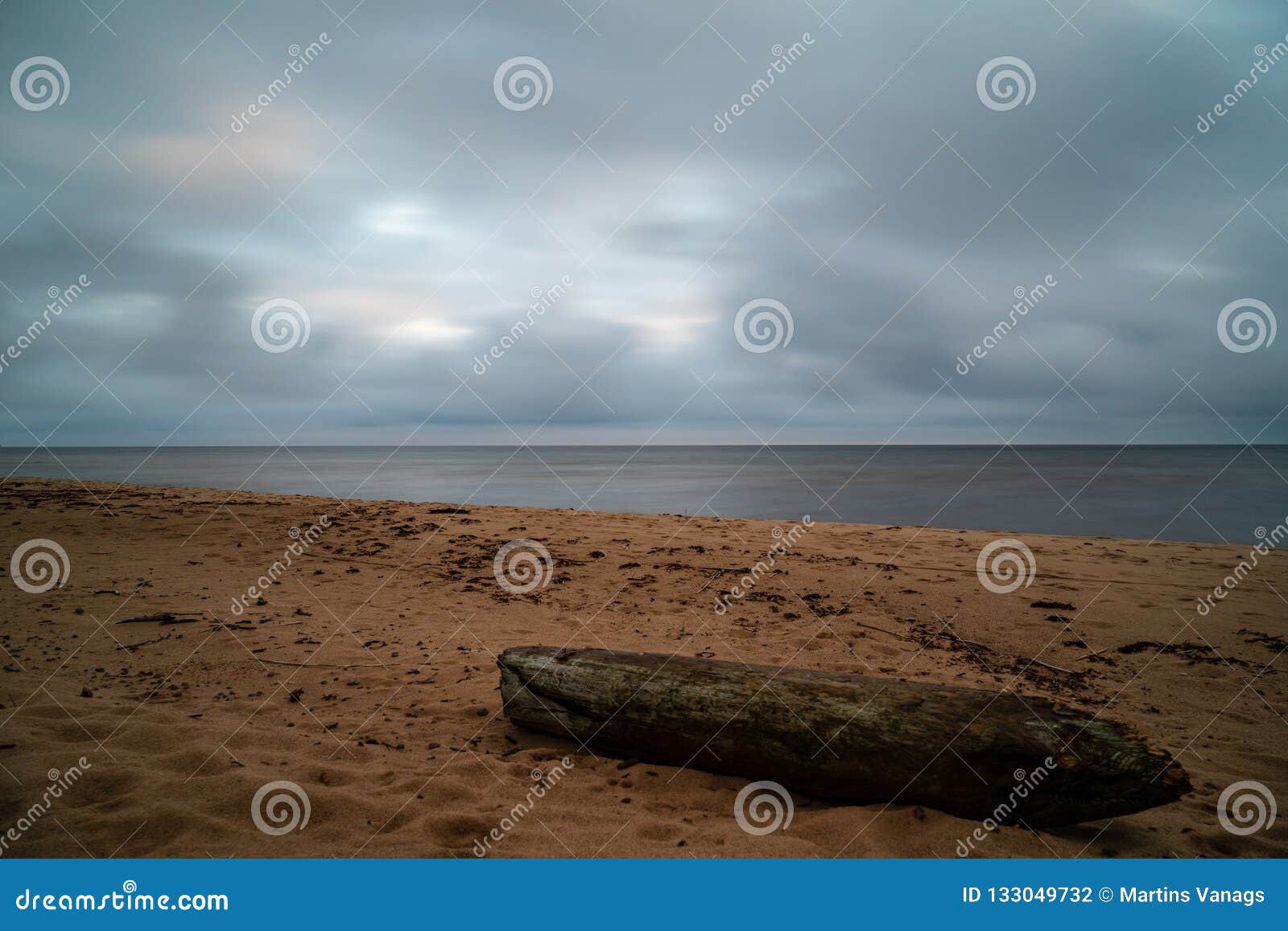 Storm Clouds Forming Over Clear Sea Beach with Rocks and Clear S Stock ...