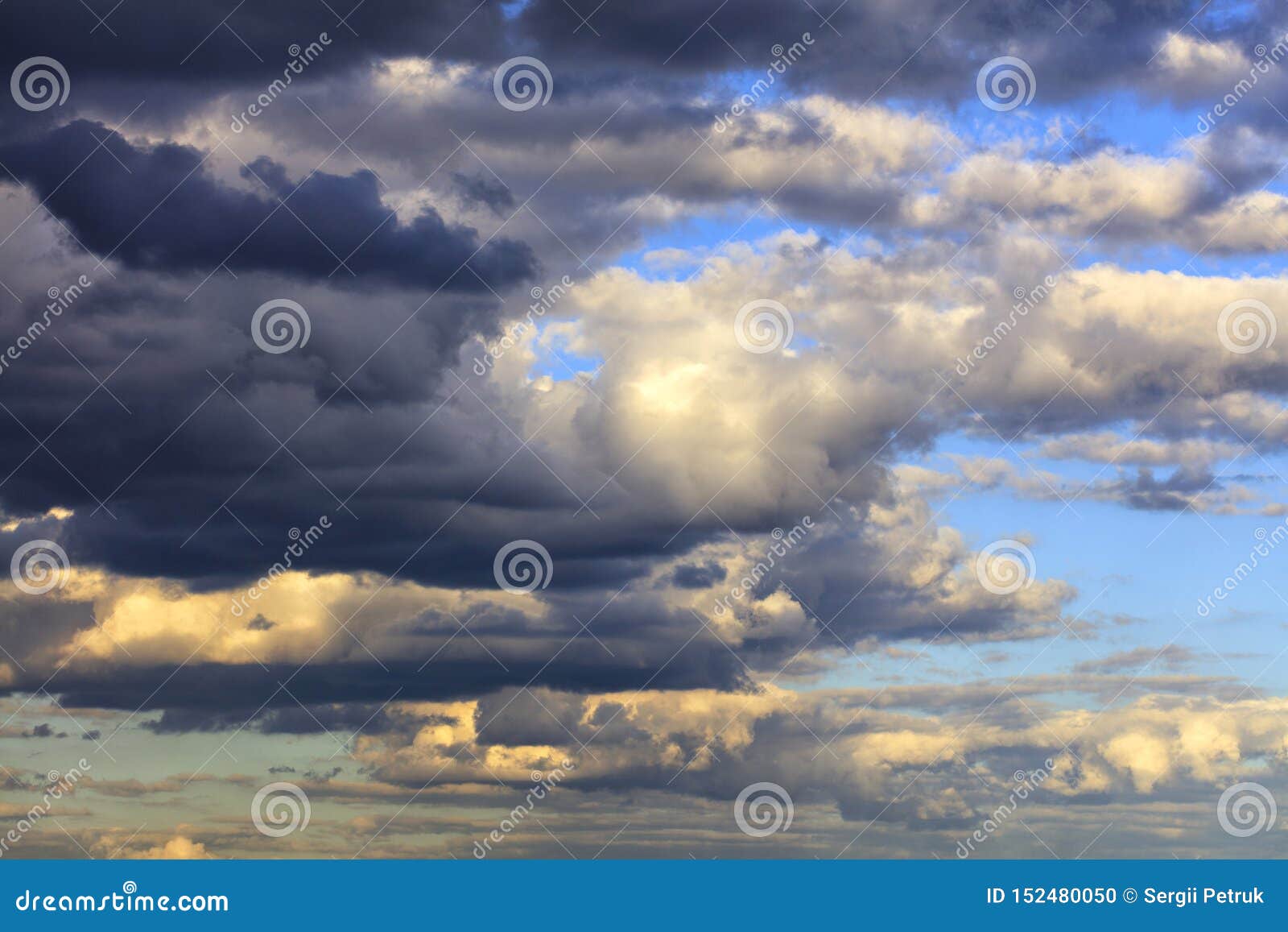Storm Clouds Gather in the Sky in the Rays of the Setting Sun Stock ...