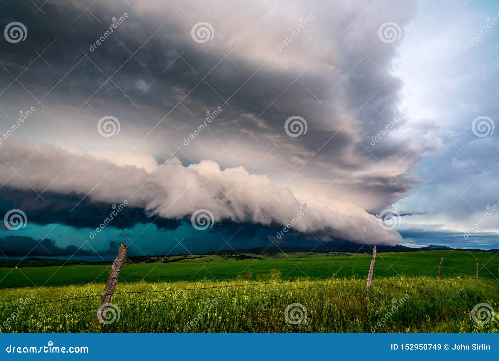 Storm Clouds Over a Green Grass Field Stock Image - Image of black ...