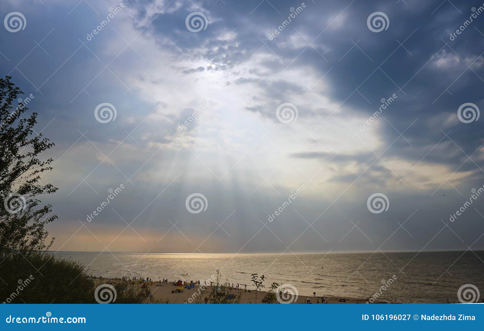 Storm Clouds at Sea, the Sun`s Rays Breaking through the Clouds Stock ...