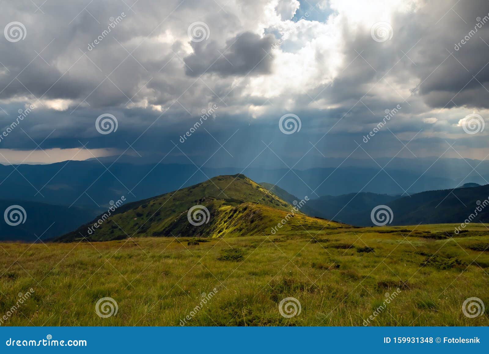 Storm Clouds and Sun Rays Over the Mountains Stock Photo - Image of ...