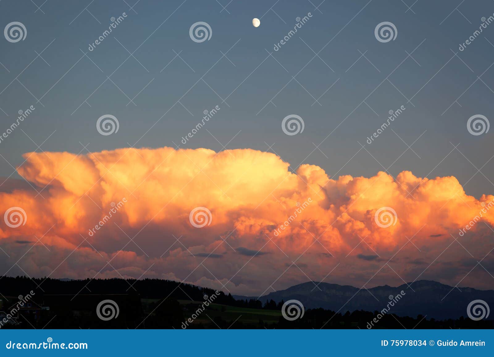 Storm Clouds at Sunset with Moon Stock Photo - Image of violent ...