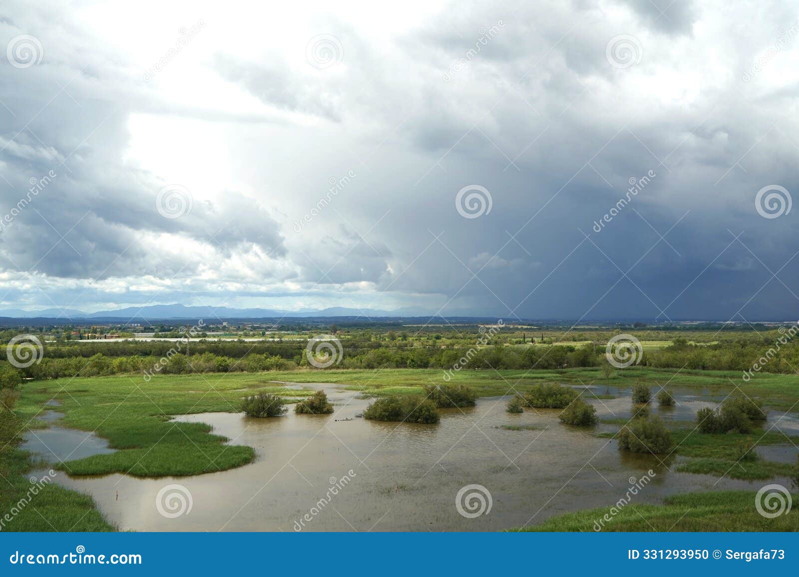Storm Clouds of Various Shades in Blue Sky at Noon. in a Marsh ...