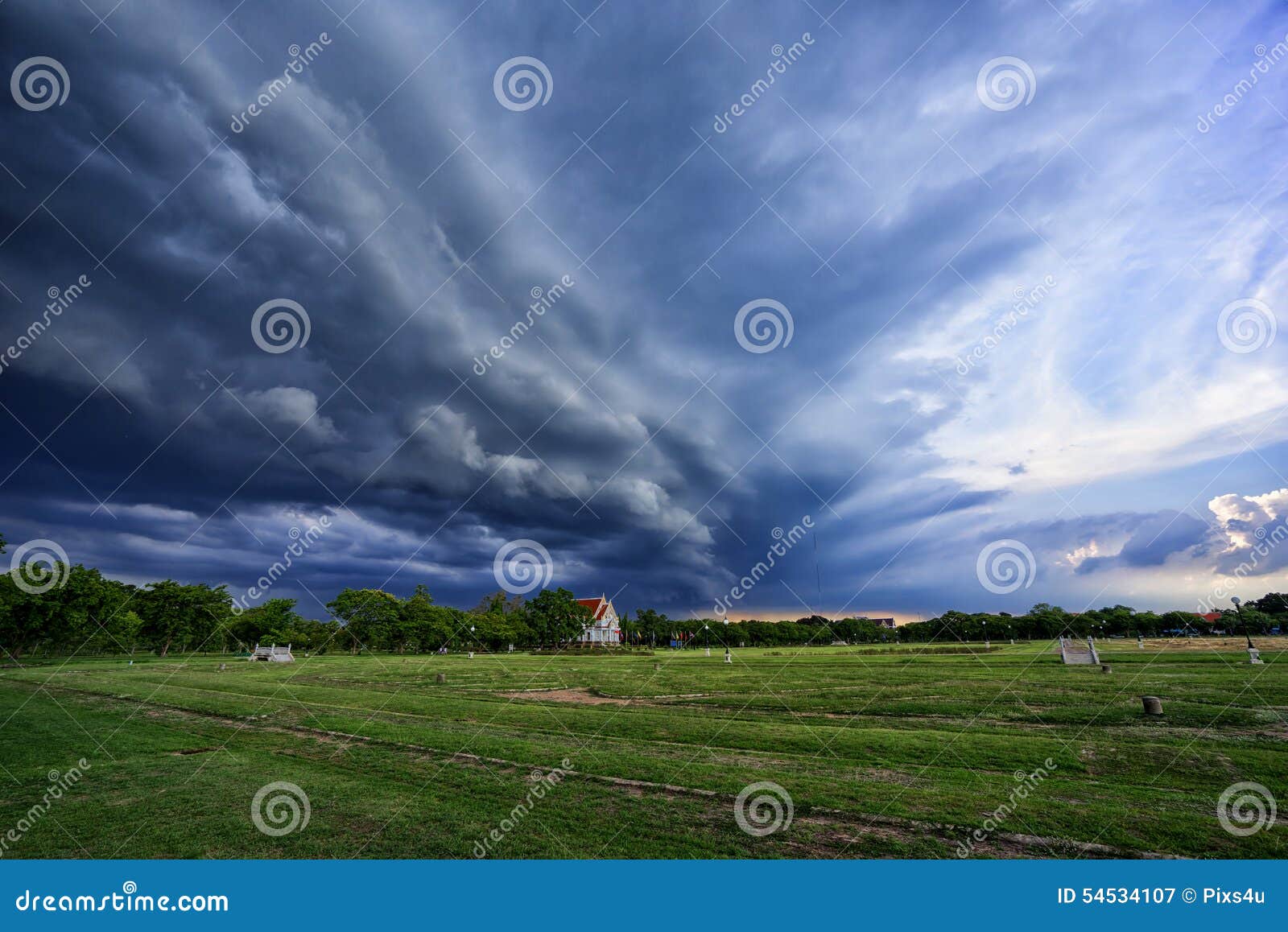Storm Dark Clouds Flying Over Field with Green Grass Stock Image ...