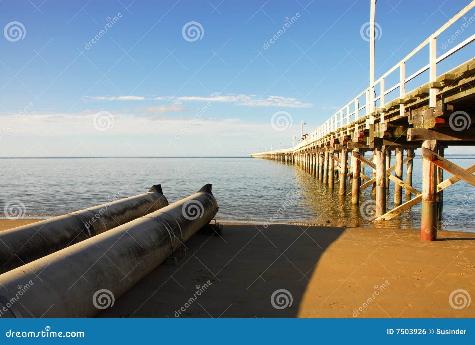 Storm drain next to pier stock photo. Image of pipes, seashore - 7503926