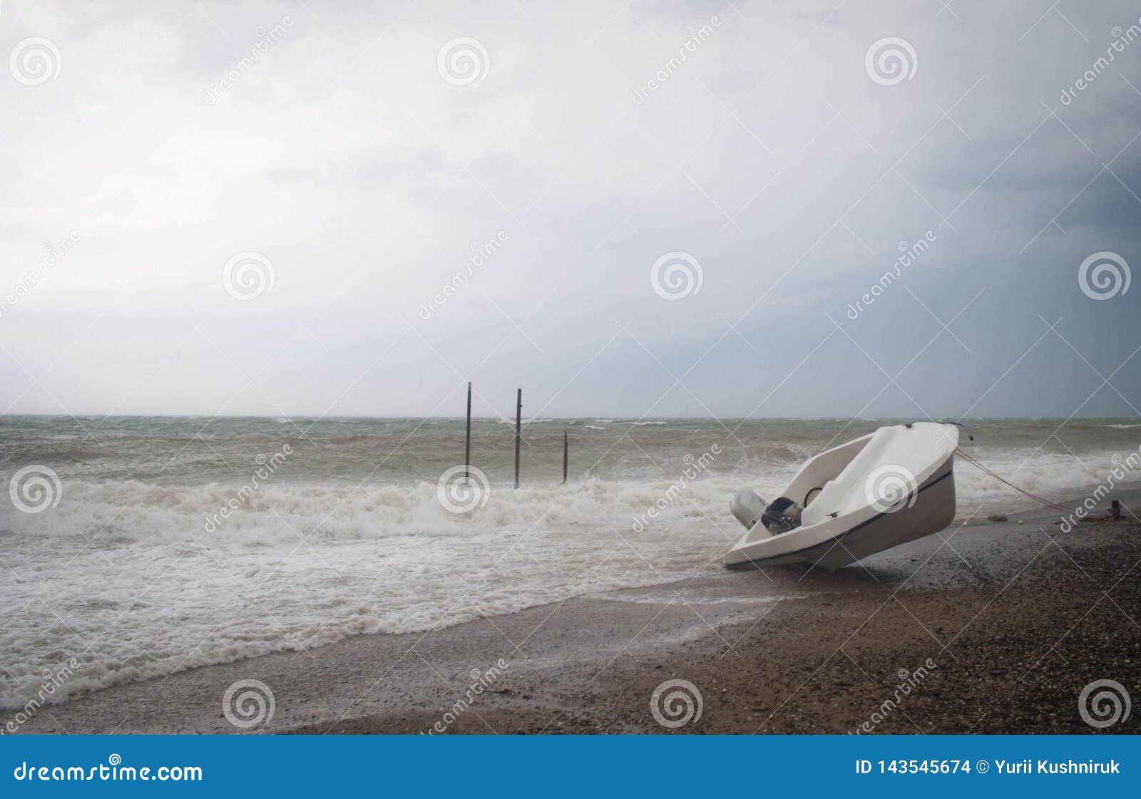 Storm on the Sea with Overturn Boat on the Beach Stock Photo - Image of ...