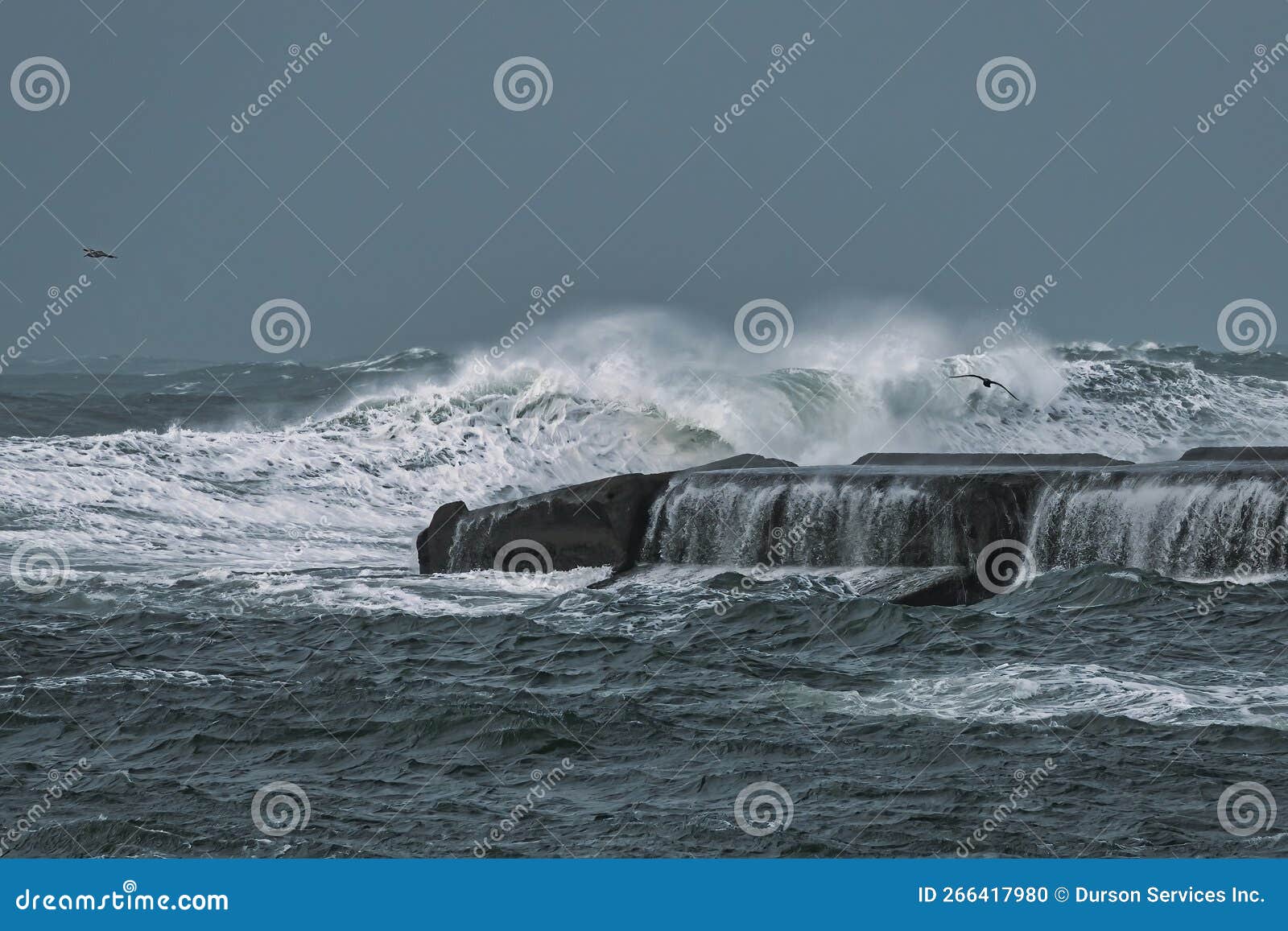 Storm Surge Creates High Waves Crashing on a Jetty Stock Photo - Image ...
