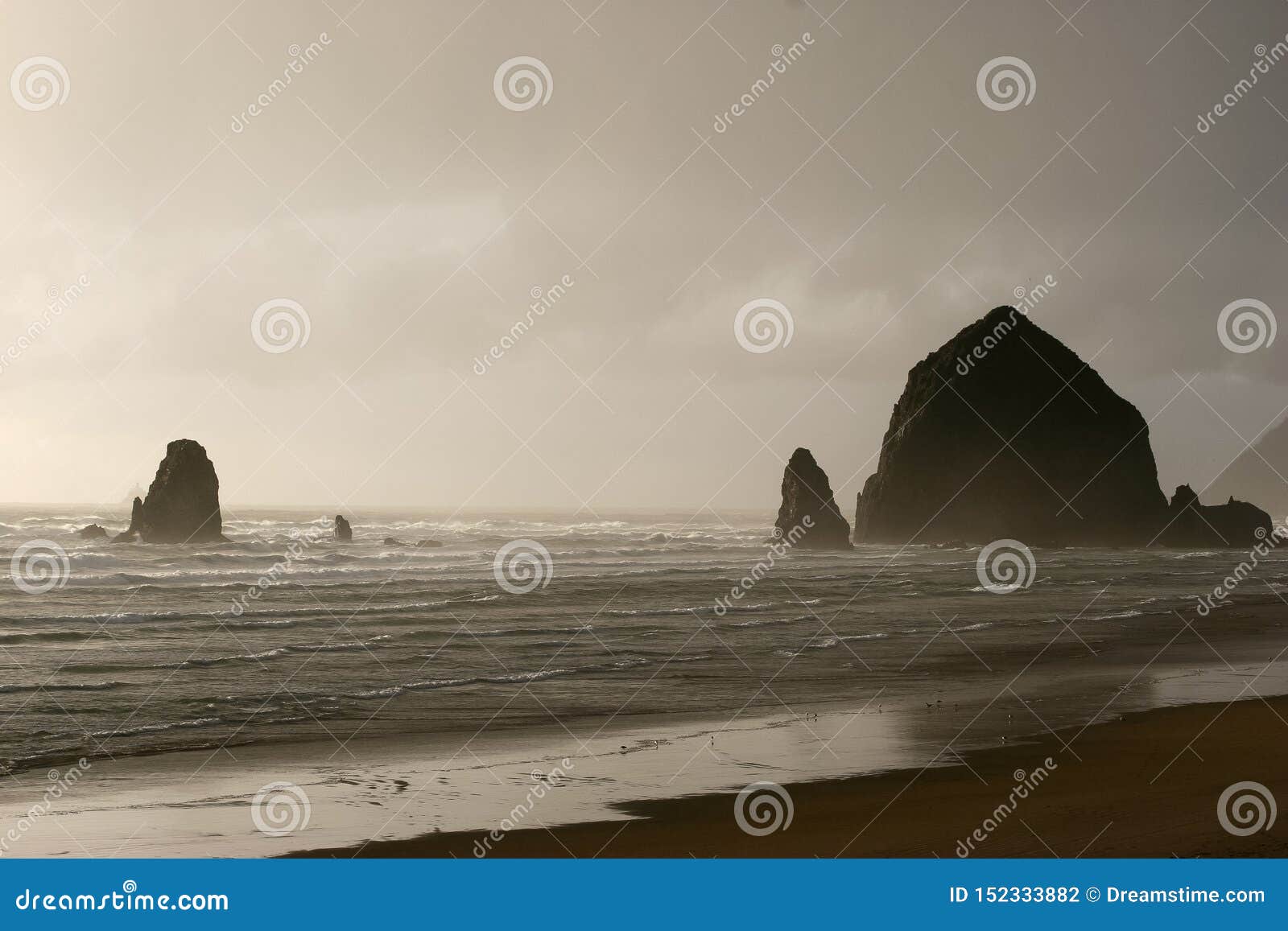 Stormy and Moody Haystack Rock Stock Photo - Image of haystack, lines ...