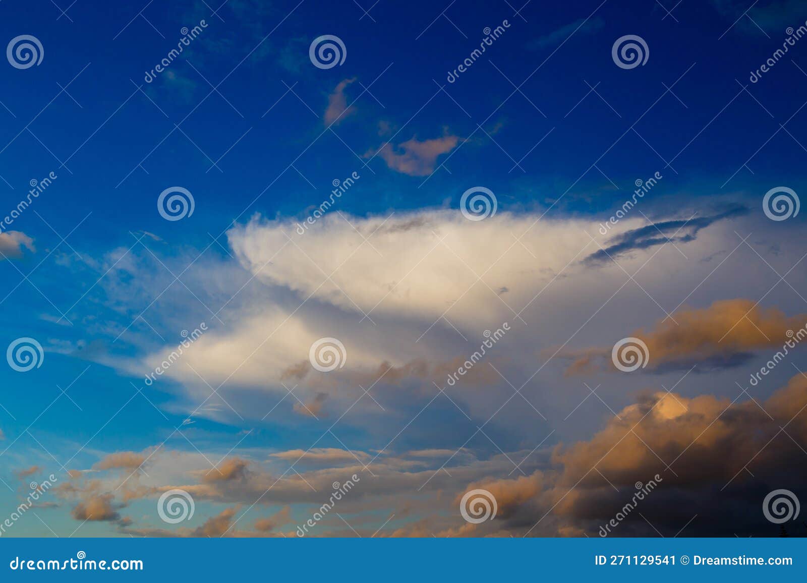 Stormy Setting Sun with Warm Light Illuminates a Dark Blue Clear Sky ...