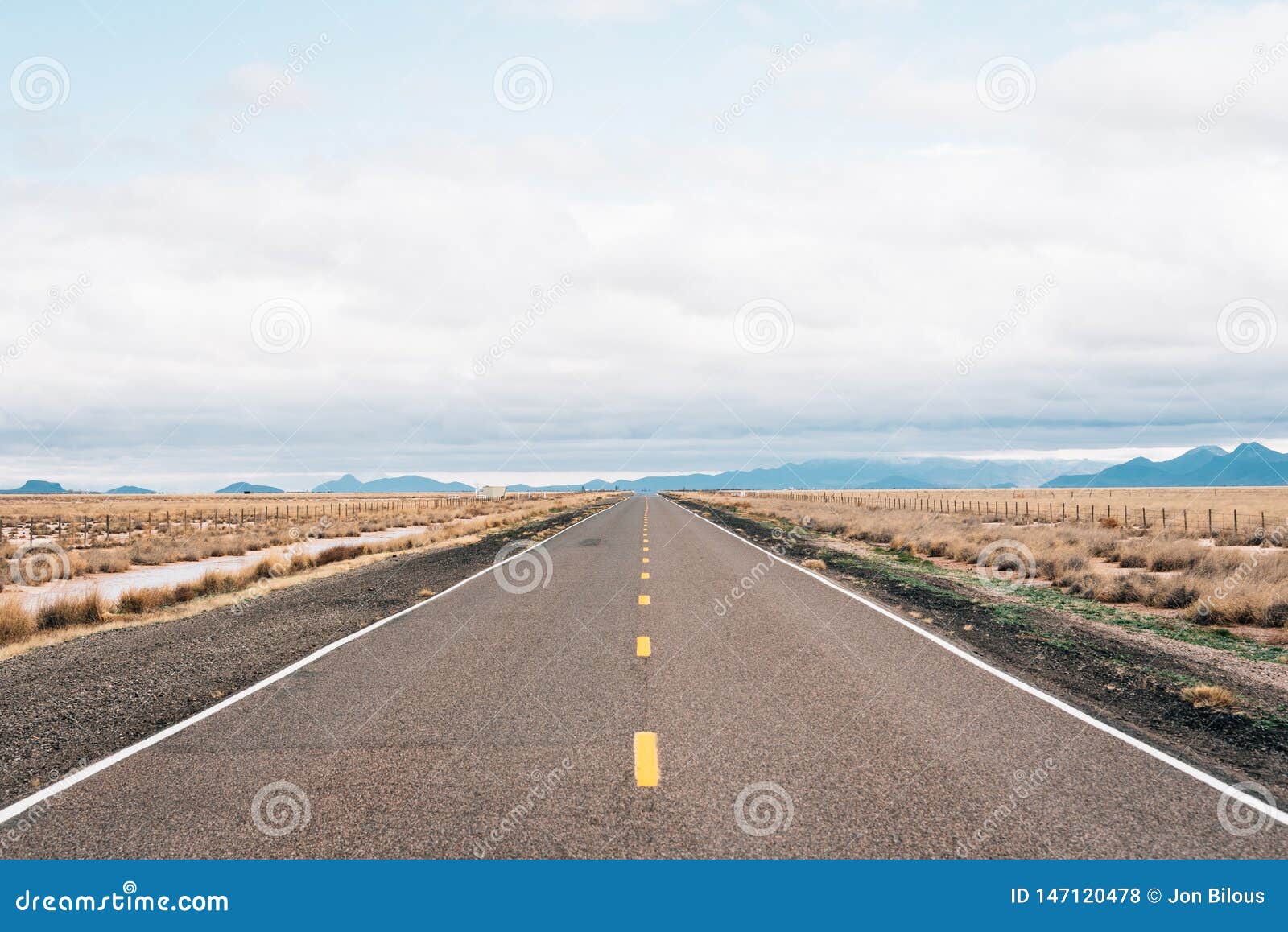 Straight, Flat Road in the Desert of New Mexico Stock Photo - Image of ...