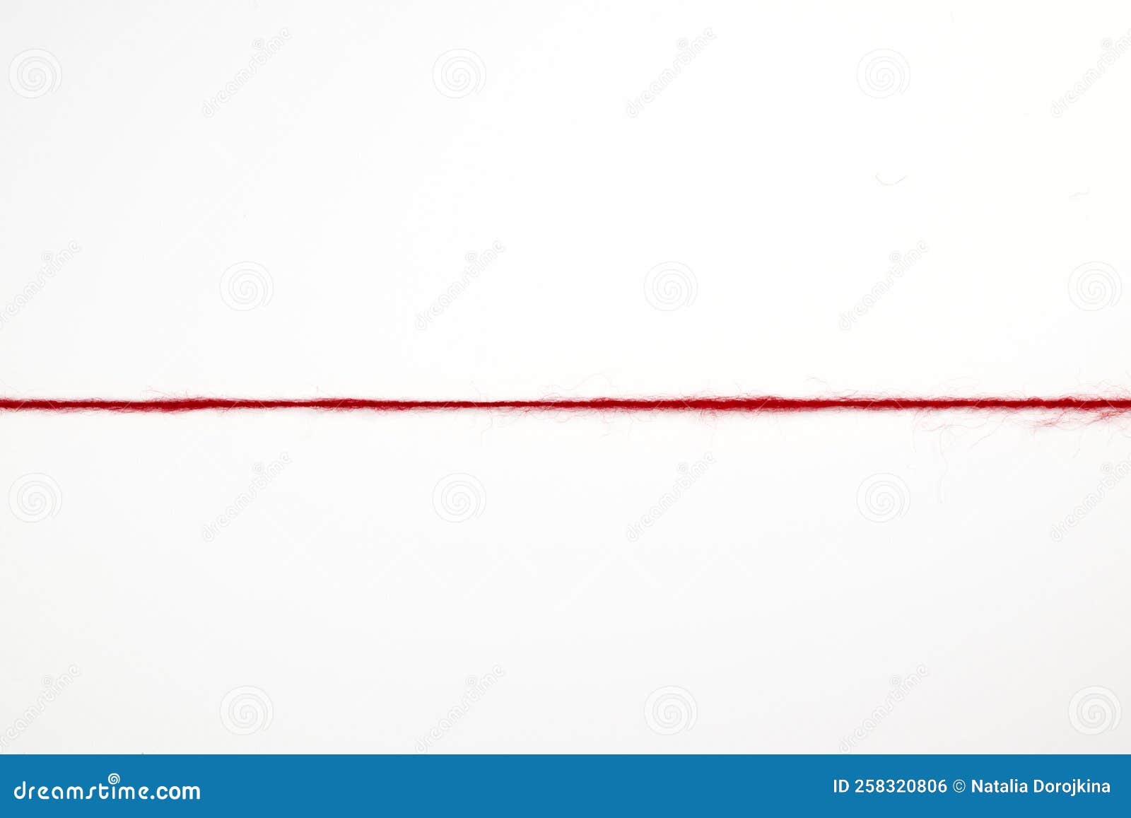 A Straight Line of Red Woolen Threads on a White Background Stock Photo ...