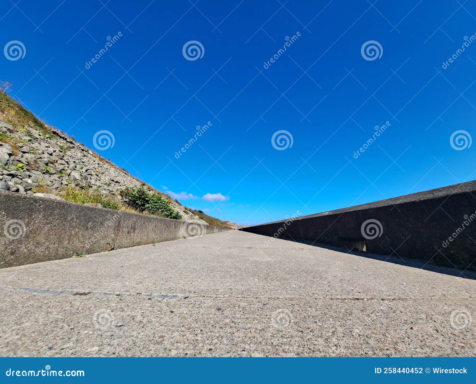 Straight Pavement Under a Clear Blue Sky Stock Photo - Image of mount ...
