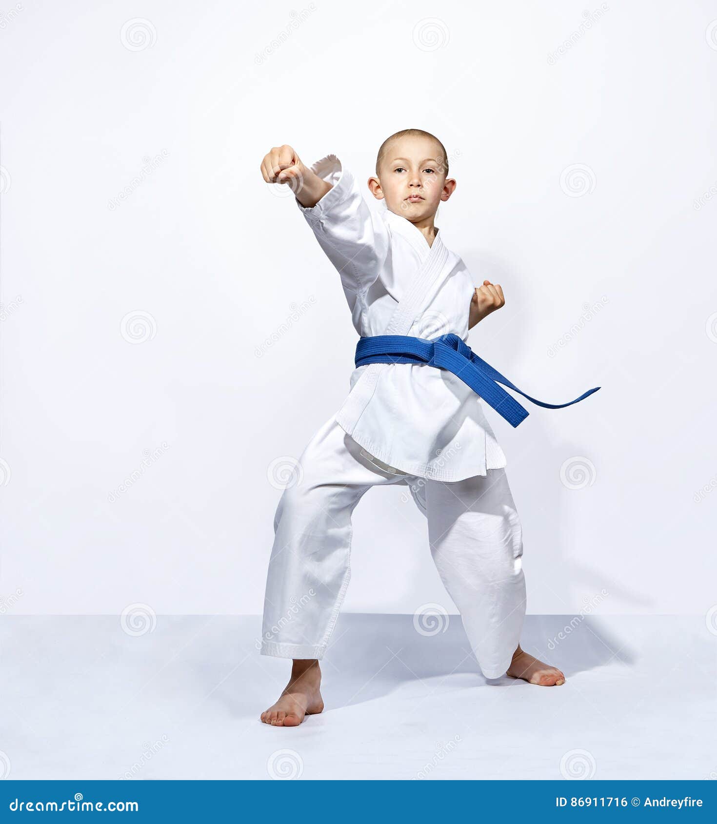 Karateka Boy With Blue Overlays On The Hands Is In The Rack Karate ...
