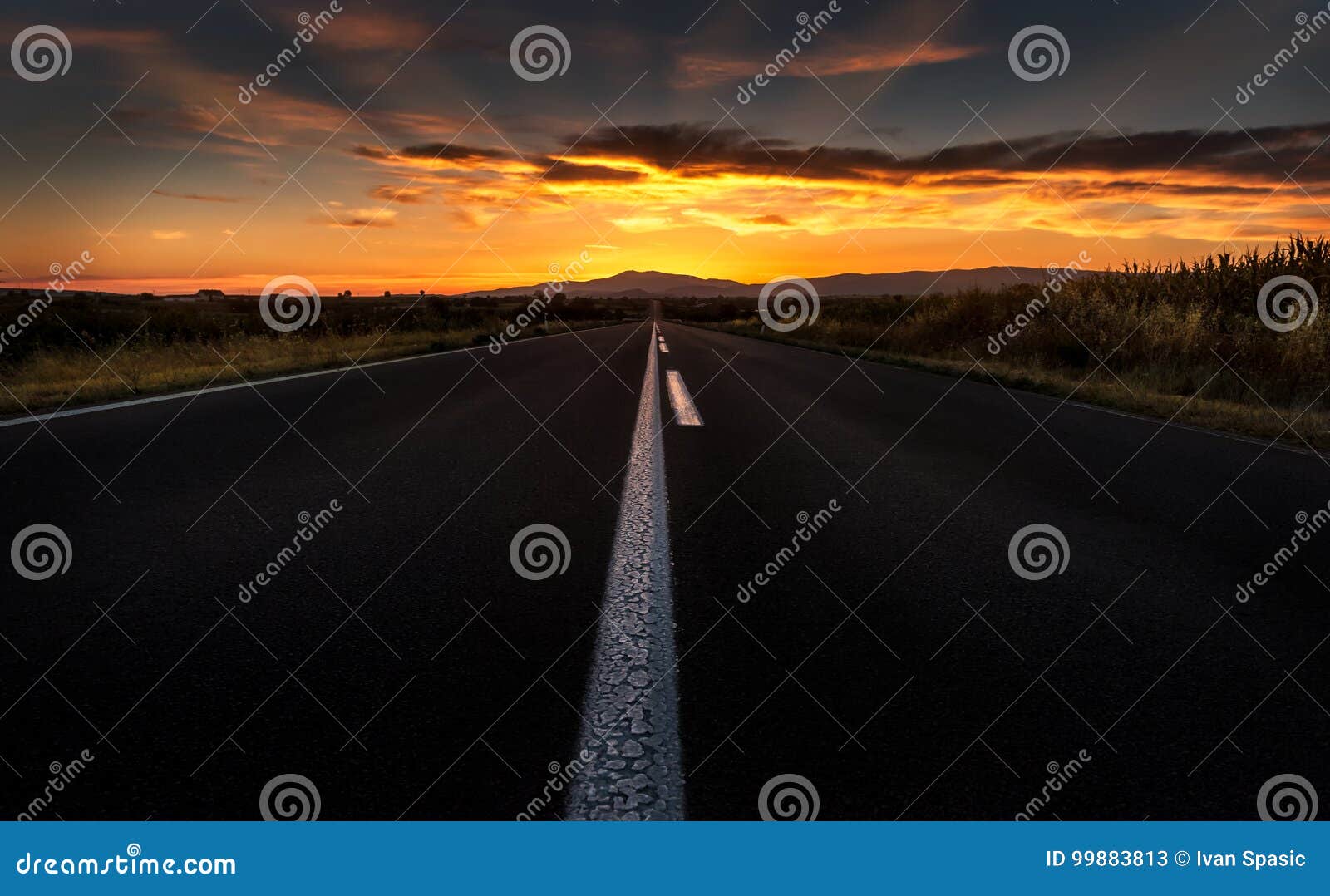 Straight road to sunset stock image. Image of orange - 99883813