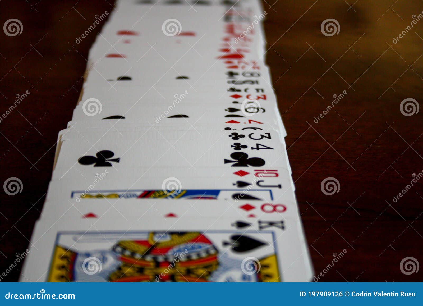 Straight Row of Playing Cards Stock Photo - Image of indoor, font ...