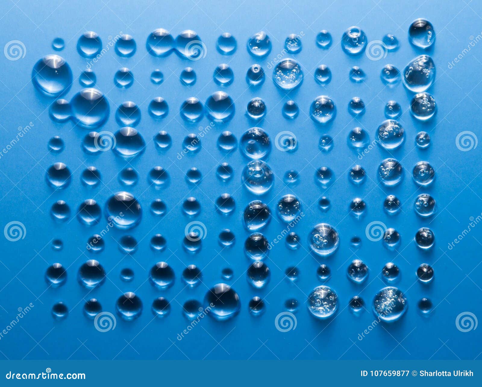 Straight Rows of a Drop of Water on a Blue Background in the Form of a ...