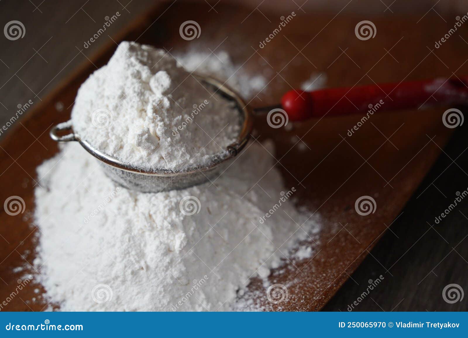 A Strainer with a Handful of Flour Lies on the Table Stock Photo ...