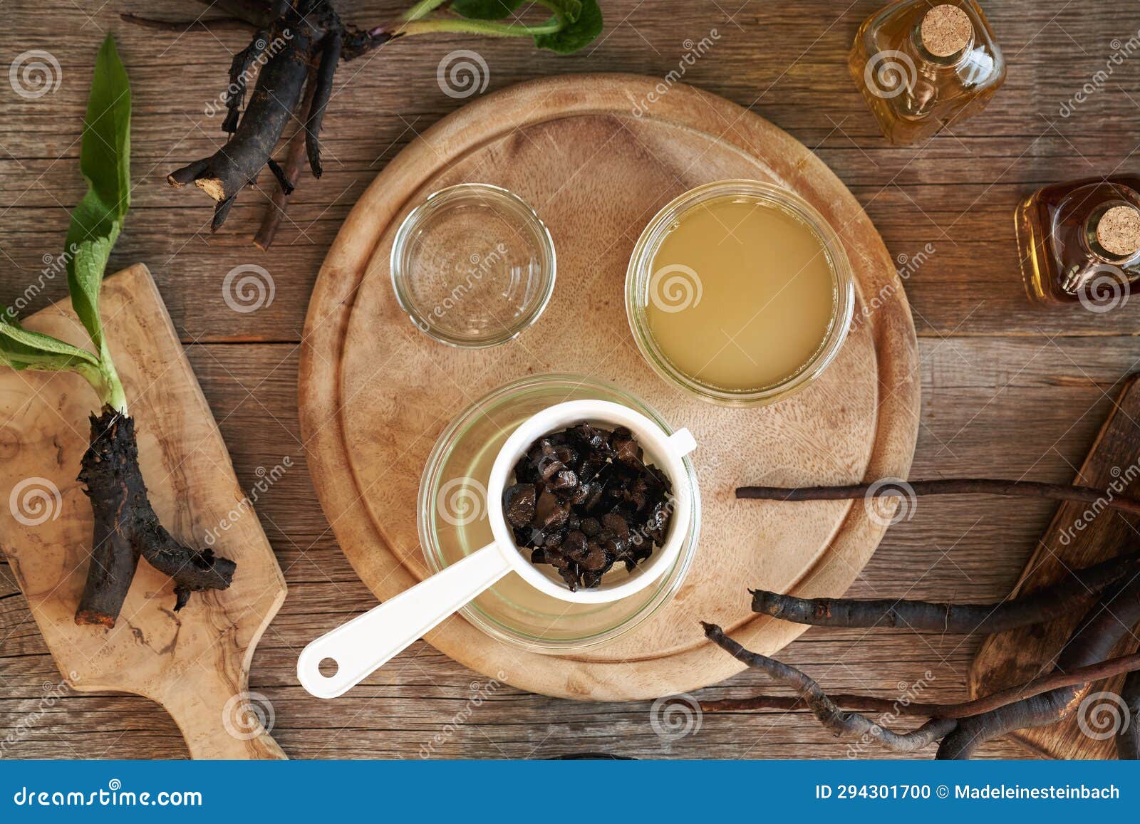 Straining Homemade Comfrey Root Ointment through a Sieve, Top View ...