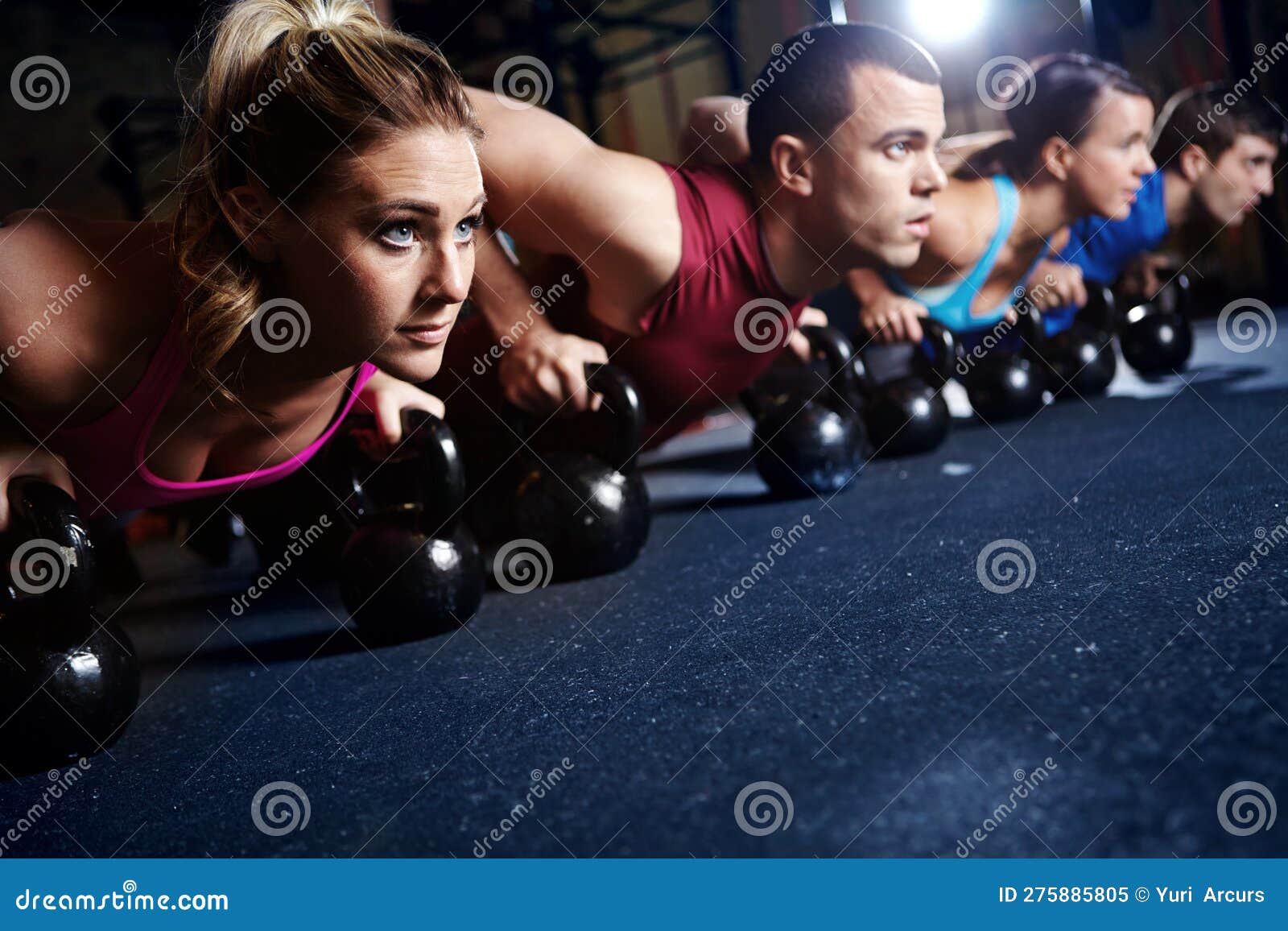 Straining and Sweating Together. Low-angle View of a Group of ...